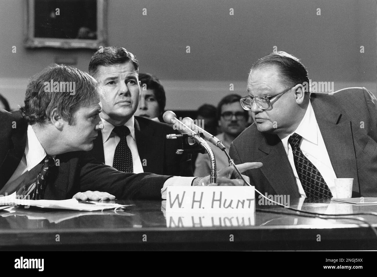 Dallas attorney Ivan Irwin Jr., left, is seen leaning over to confer ...