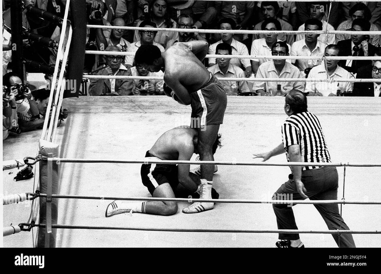 Heavyweight George Foreman straddles Joe King Roman after he knocked ...