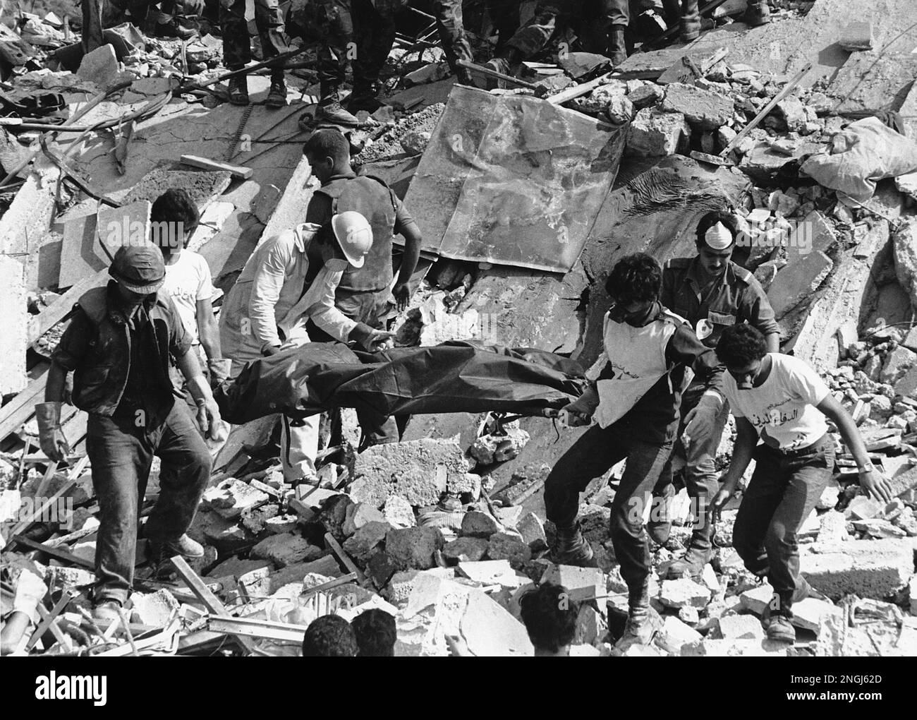 Rescue workers are shown carrying the body of a U.S. Marine killed by ...