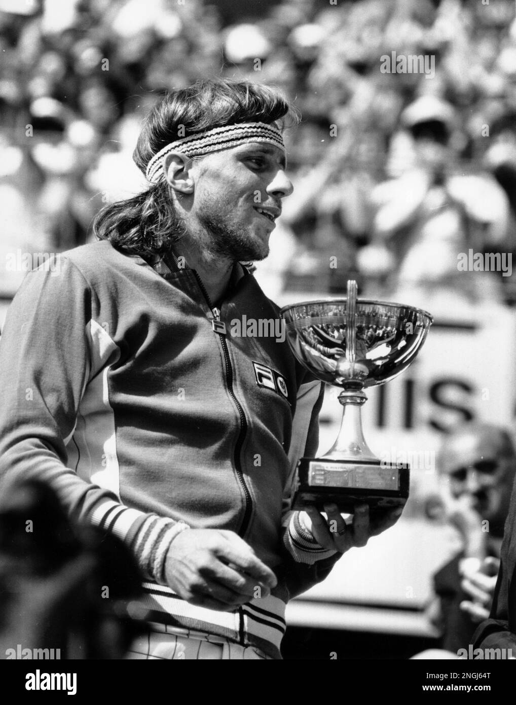Bjorn Borg is shown holding the trophy, presented by Henri Cochet ...