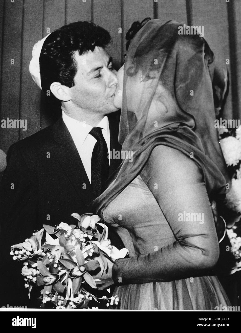 Elizabeth Taylor and Eddie Fisher share a kiss after they are married ...