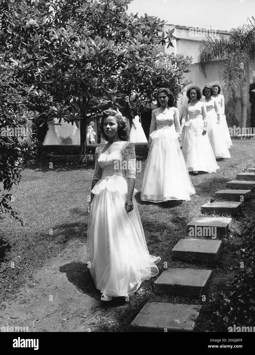 Shirley Temple walks in the procession at her high school commencement ...