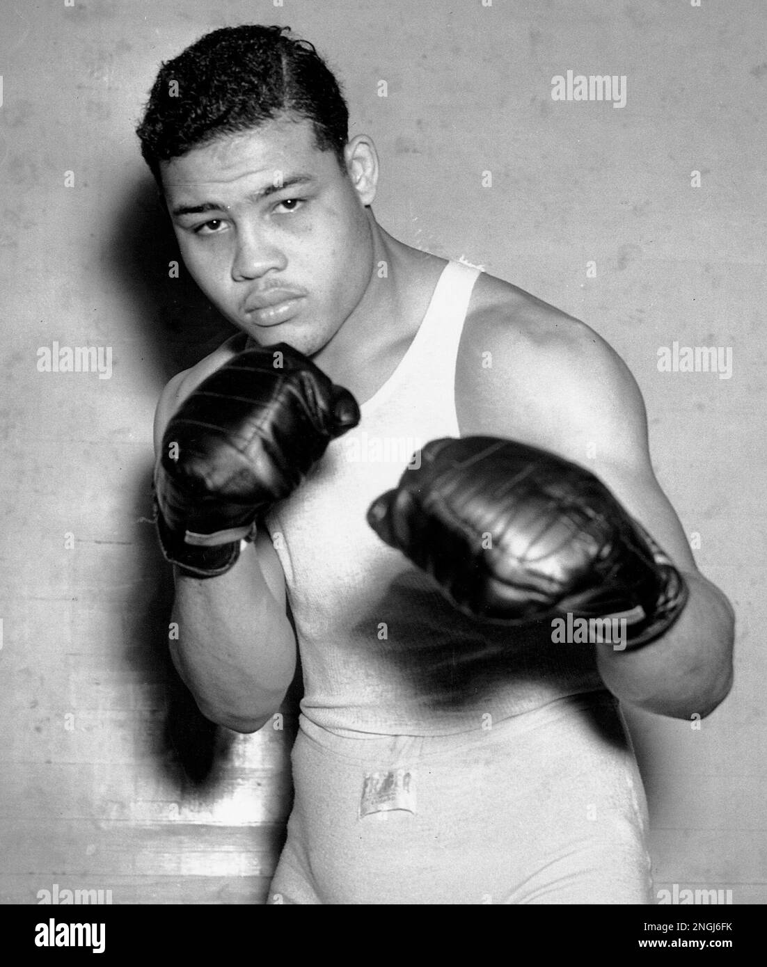Fighter Joe Louis, nicknamed the Brown Bomber, poses in his boxing ...
