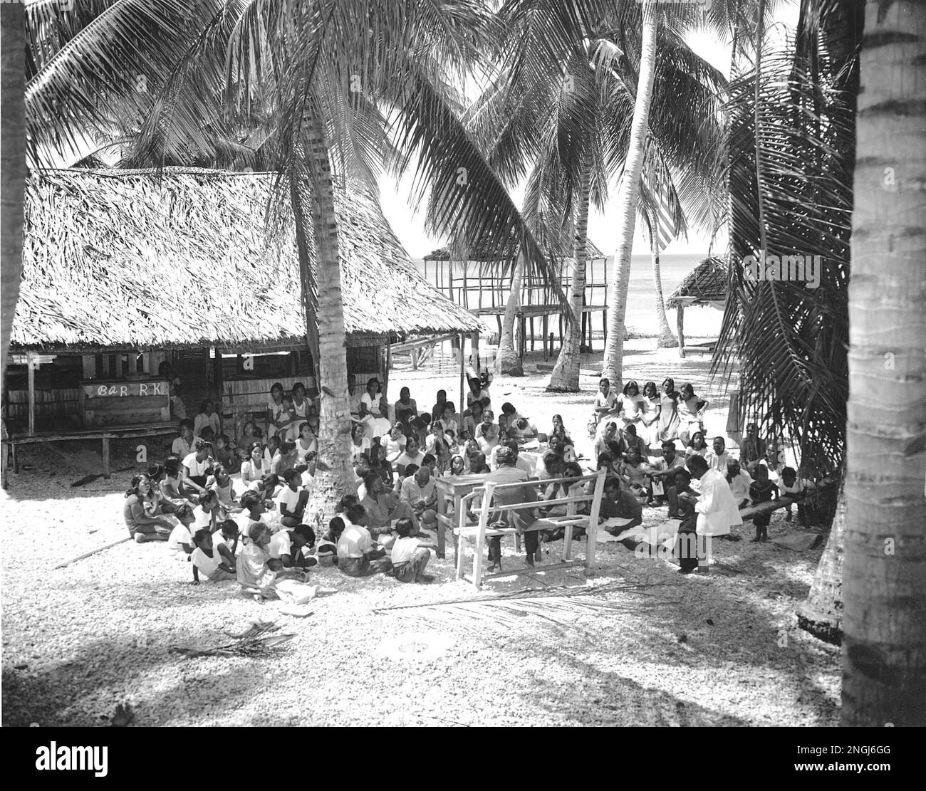 The Natives of Bikini Atoll, Marshall Islands, gather in the open for ...