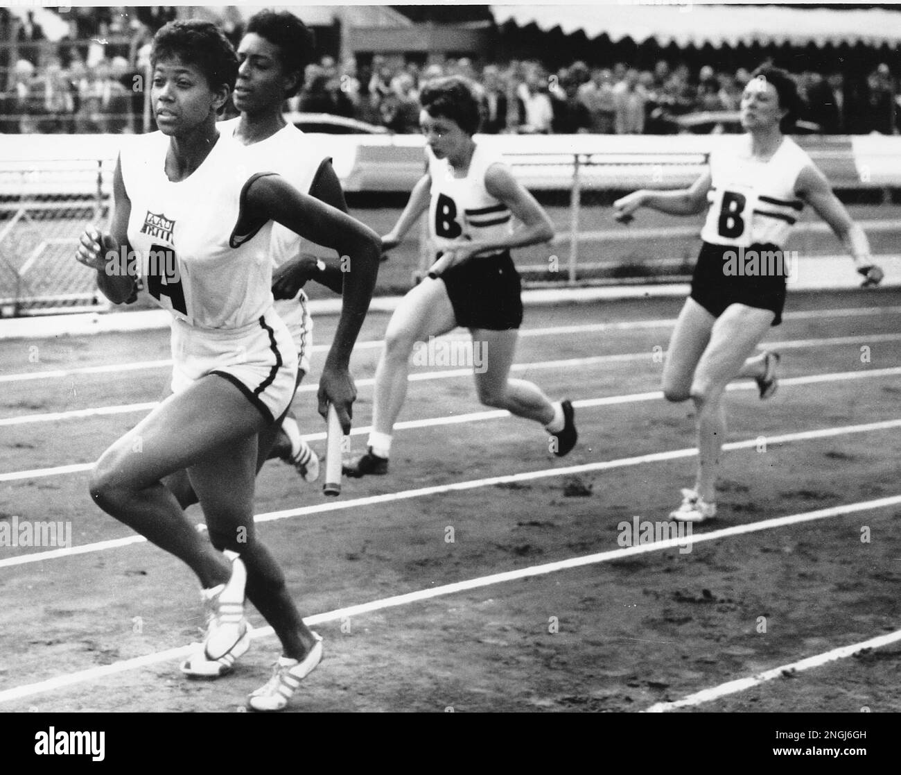 Wilma Rudolph, left, takes the baton from American teammate Vivian ...