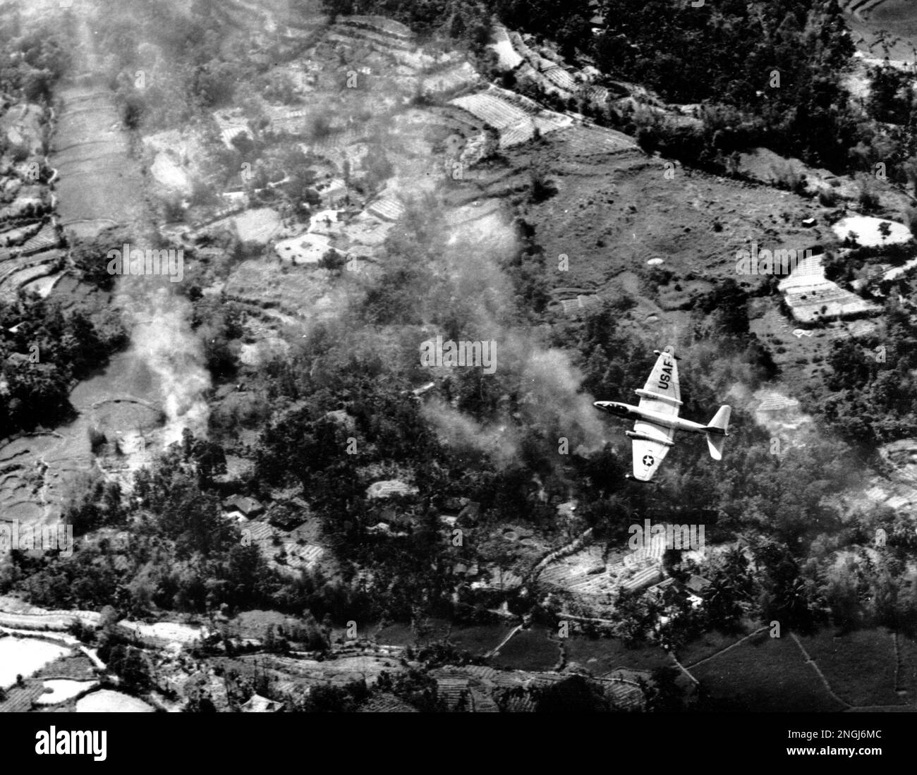 An Air Force B-57 Canberra swoops over a suspected Viet Cong jungle ...
