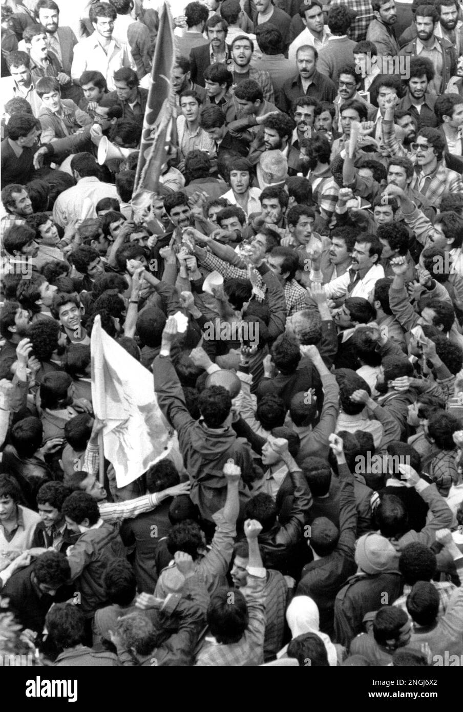 Shouting student demonstrators reach out to grab the last shreds of the ...
