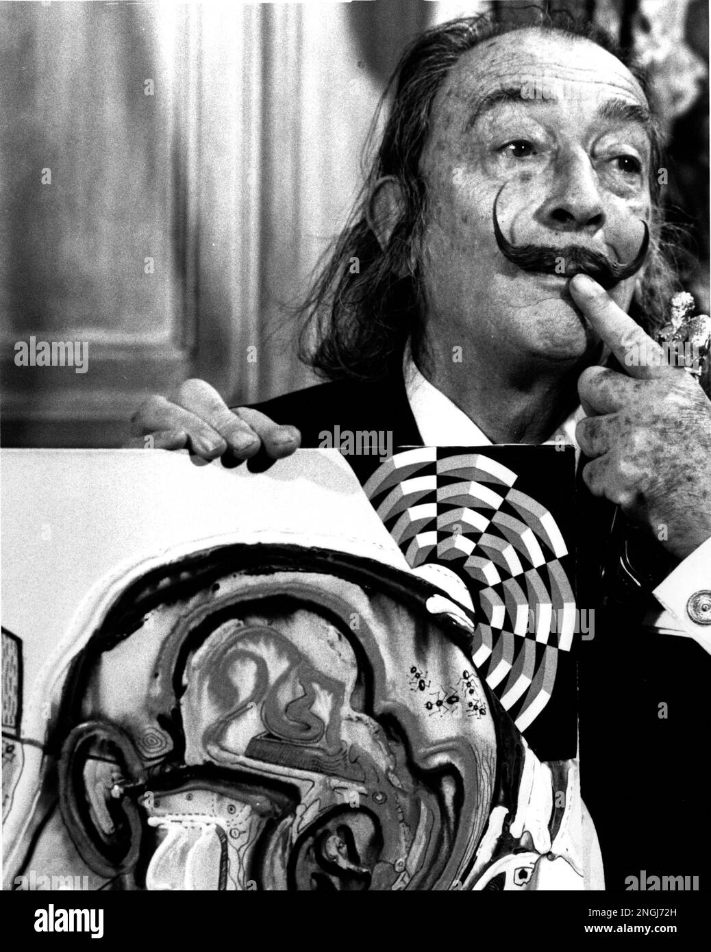 Artist Salvador Dali unveils one of his new paintings, part of a ...