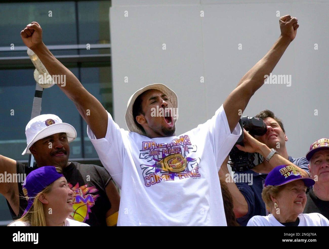 Los Angeles Lakers' guard Kobe Bryant gestures to the crowd from atop a ...