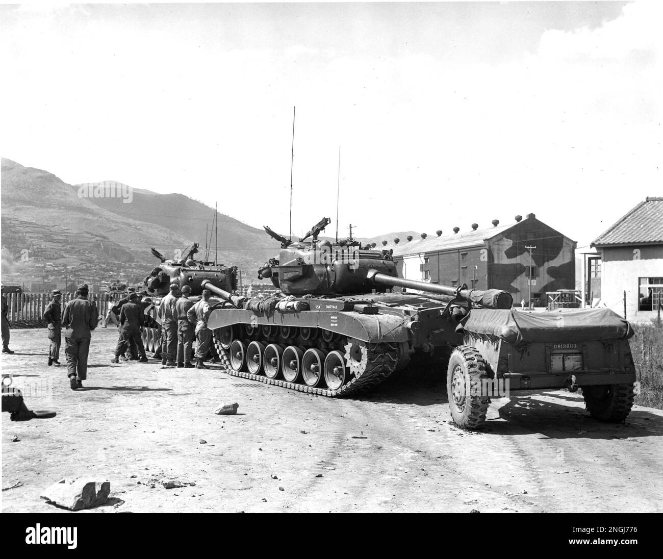 These heavy American tanks (M26), mounting 90mm guns are readied for ...