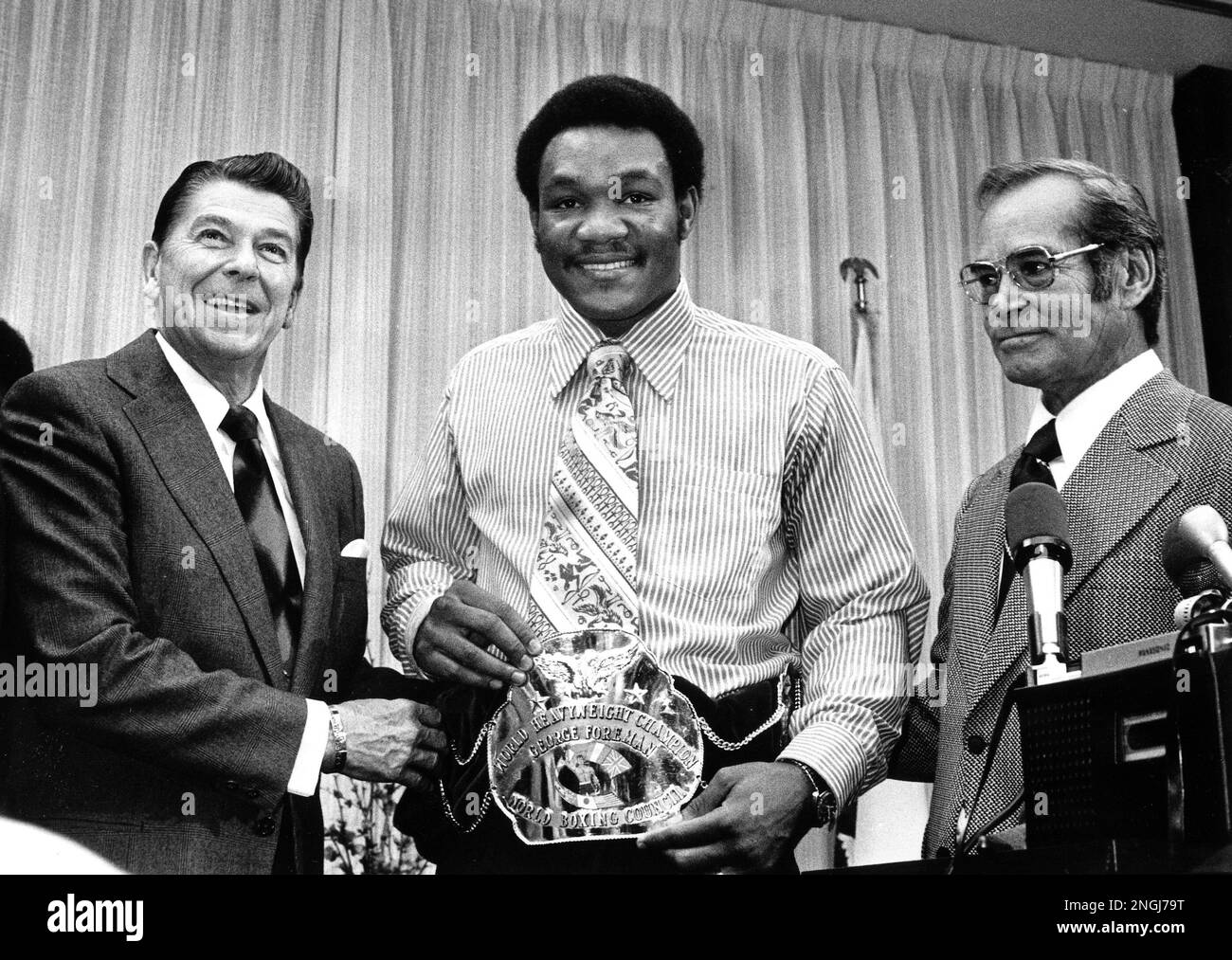 Heavyweight champ George Foreman, right, poses with his World Boxing ...