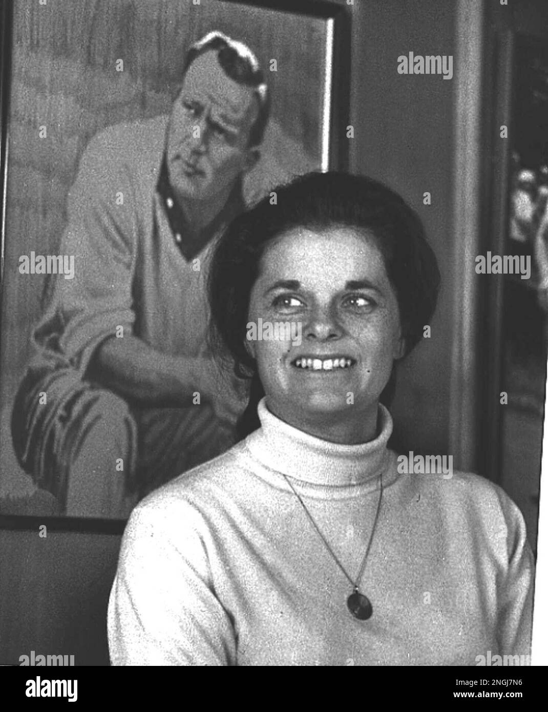 Winnie Palmer stands in front of a painting of her famous husband ...