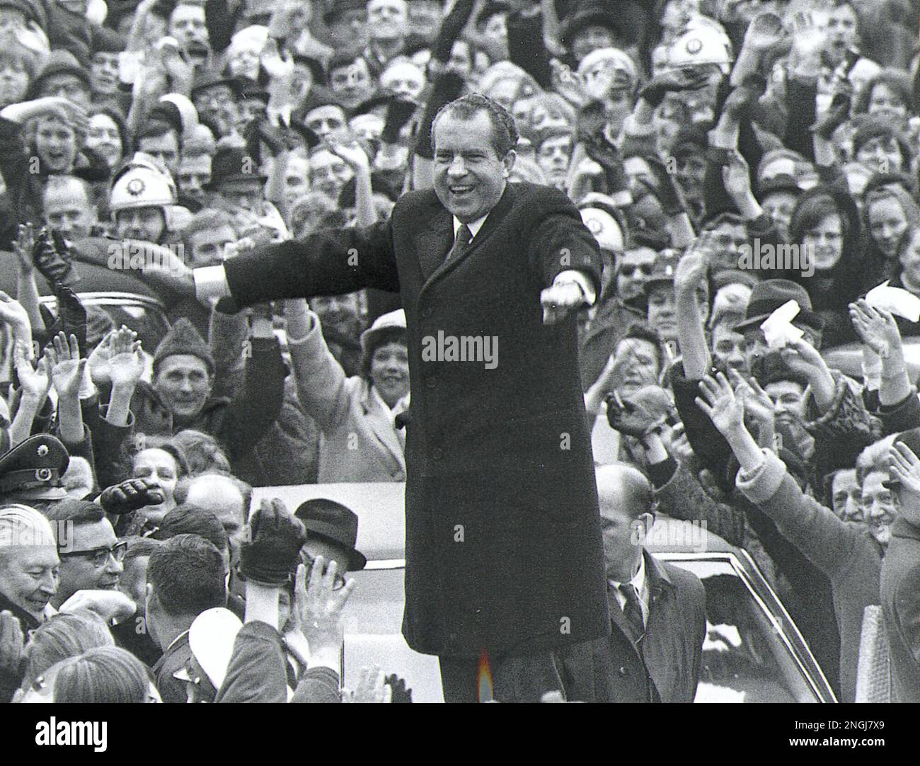 Visiting U.S. President Richard M. Nixon extends both hands while ...
