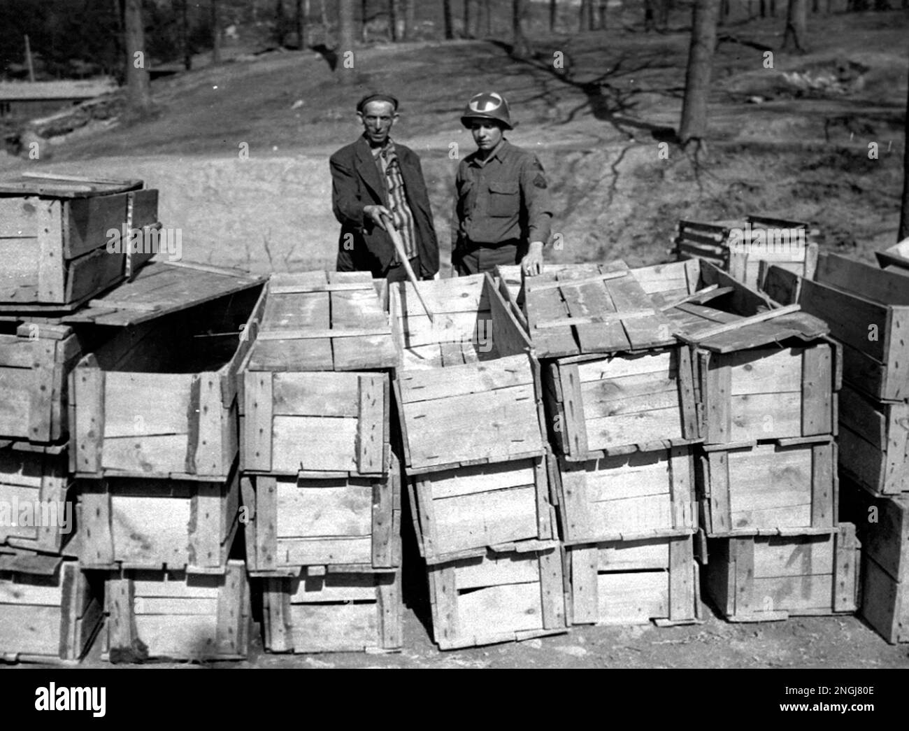 An unidentified prisoner, left, talks to ambulance driver Francis Smith ...