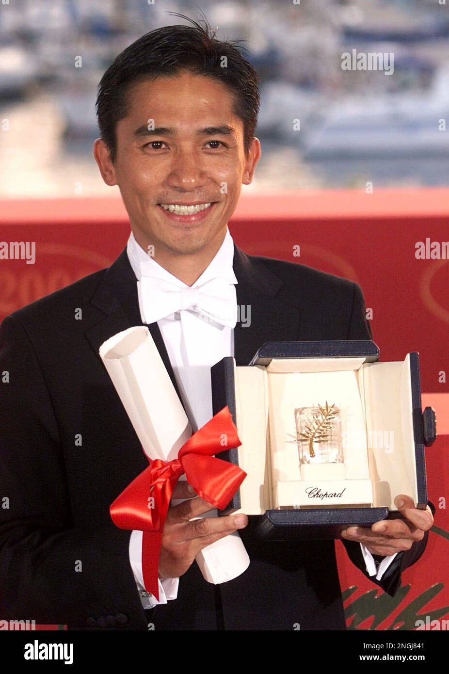 Honk Kong actor Tony Leung Chiu-Wai poses his best actor award of the ...