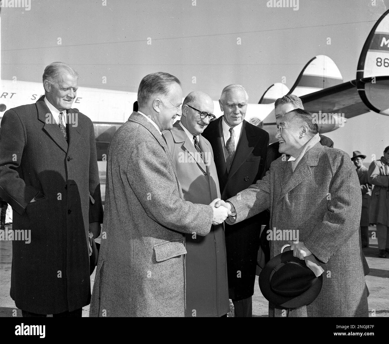 Japanese Prime Minister Yoshida gets a farewell handshake from ...