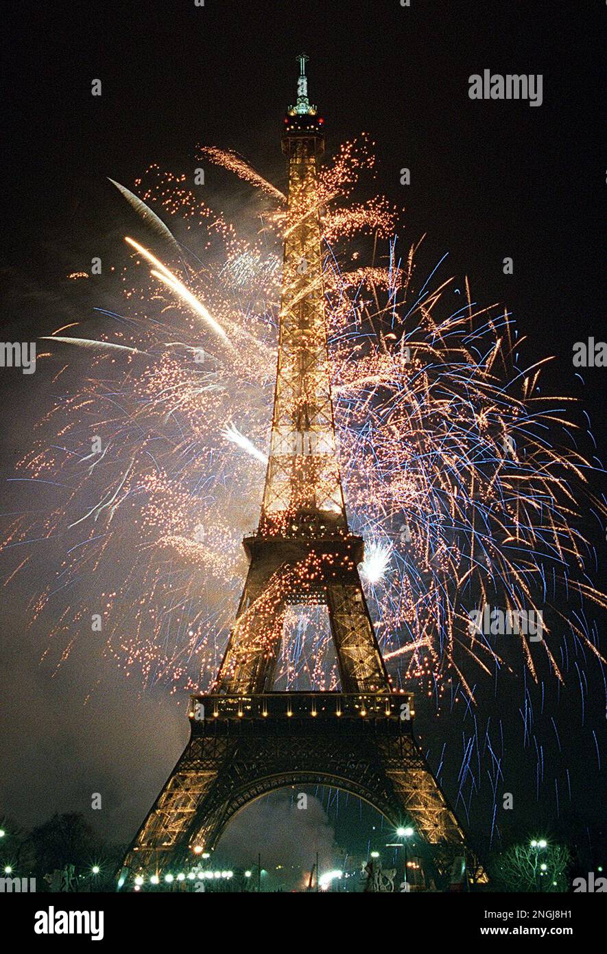 Fireworks illuminate the Eiffel Tower during celebrations for the ...