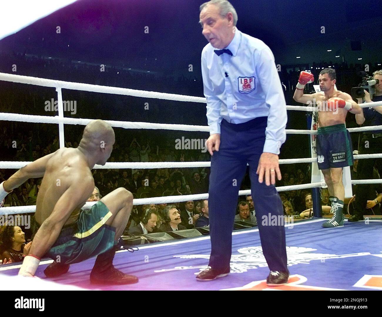 German boxer Sven Ottke, right, celebrates while his opponent Lloyd ...