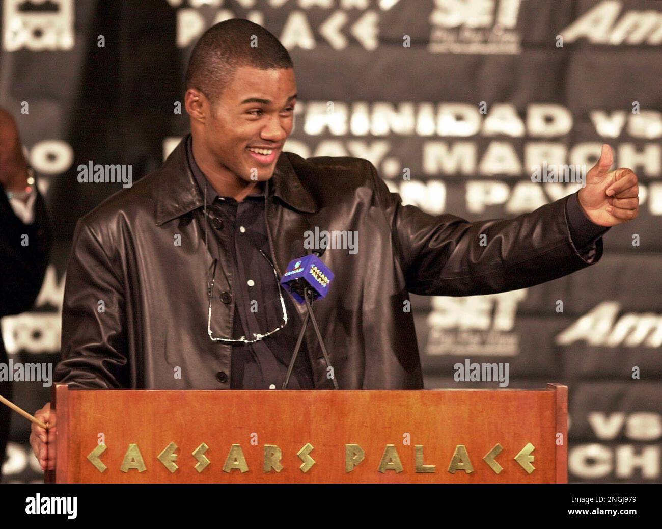 Felix Trinidad of Puerto Rico gestures during a post-fight news ...