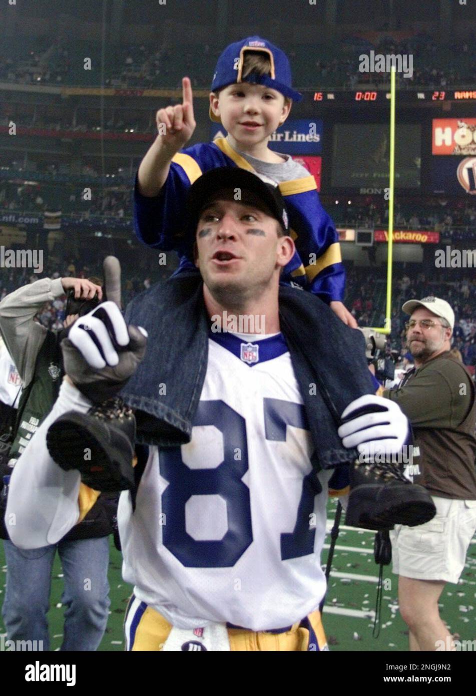 St. Louis Rams wide receiver Ricky Proehl (87) carries his son, Austin ...