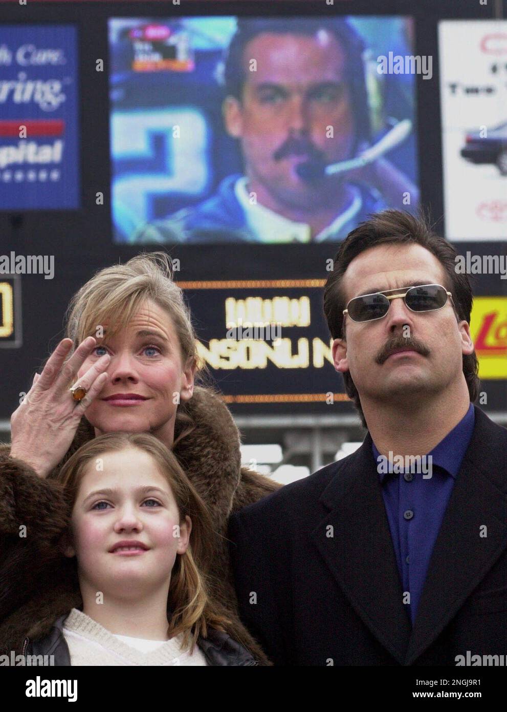 Juli Fisher wipes away a tear as she and her husband, Tennessee Titans ...