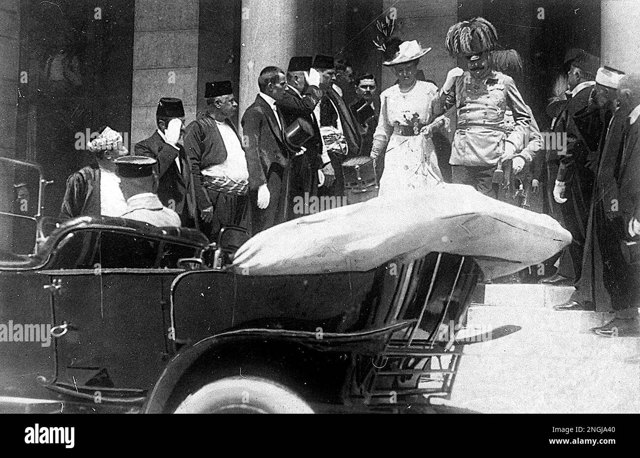 Archduke of Austria Franz Ferdinand walks to a car with his wife Sophie in Sarajevo on June 28 ...