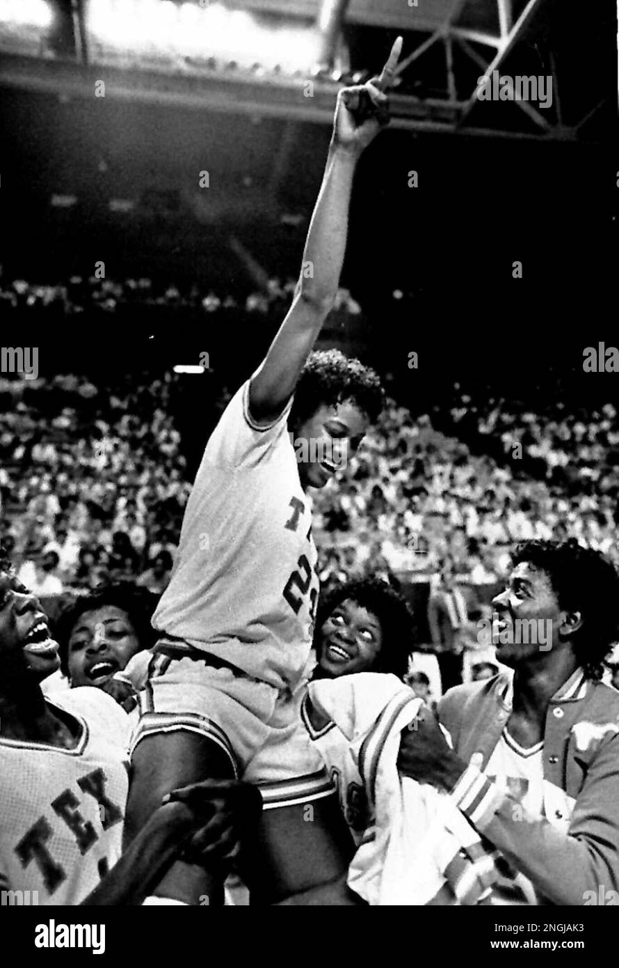 Texas forward Clarissa Davis is lifted by her teammates March 30,1986 ...
