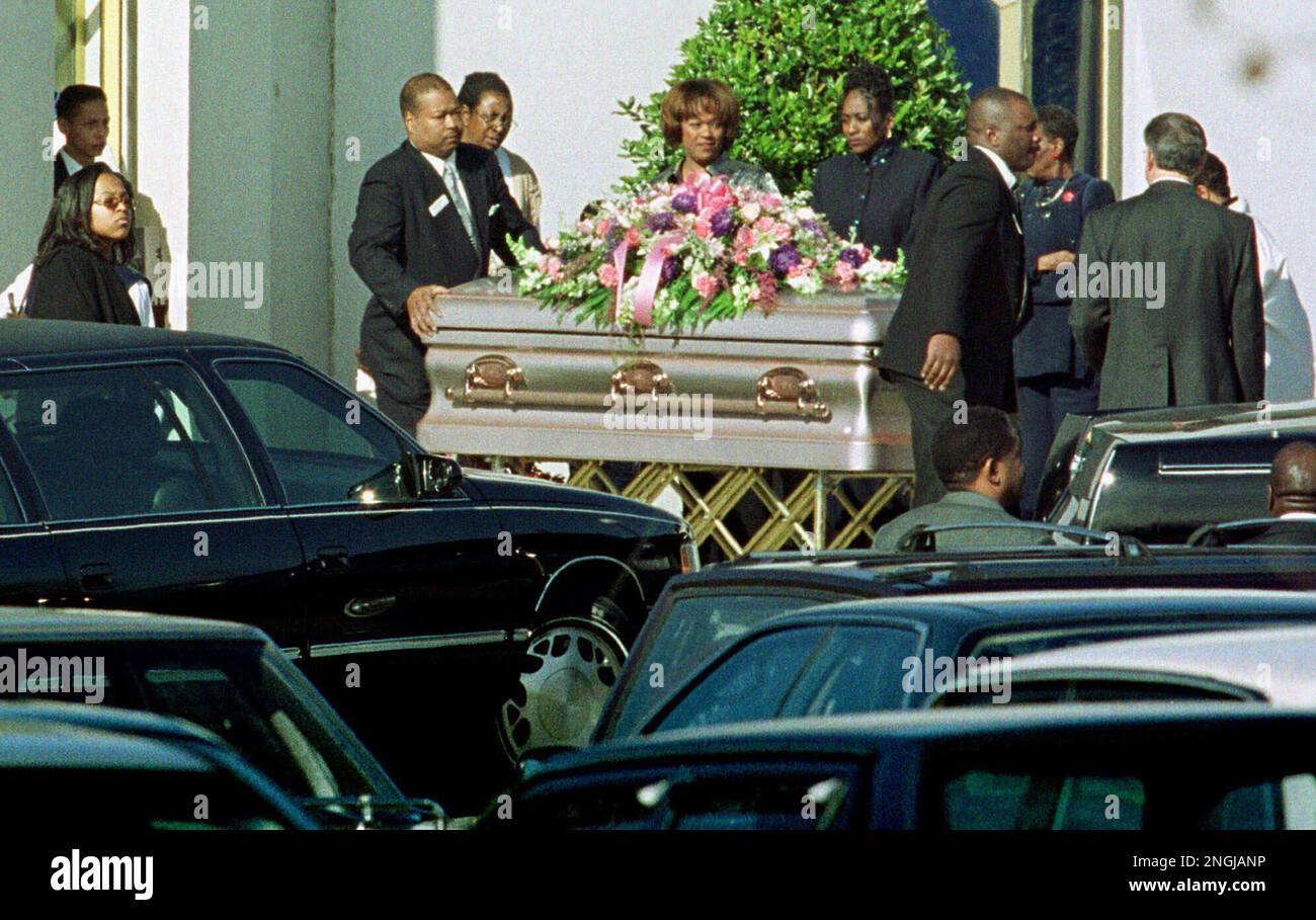 The casket carrying the body of Cherica Adams leaves a church in ...