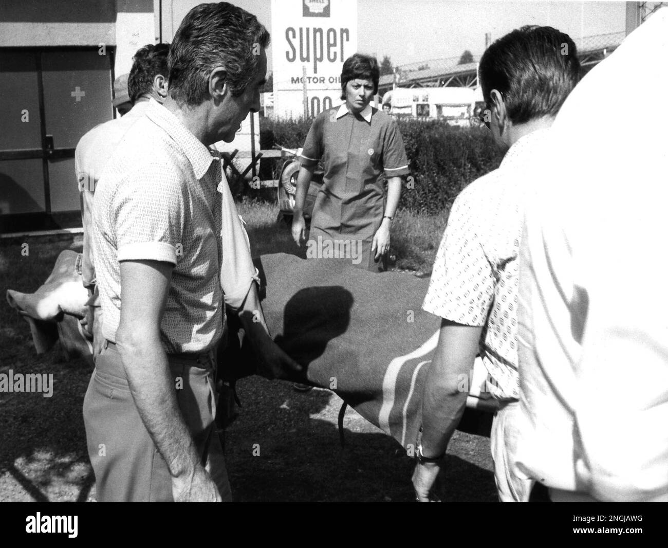 People surround the stretcher on which the body of Austrian Jochen ...