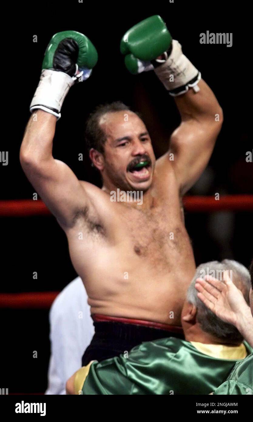 Tony Ayala Jr., of San Antonio, is lifted by members of his corner ...