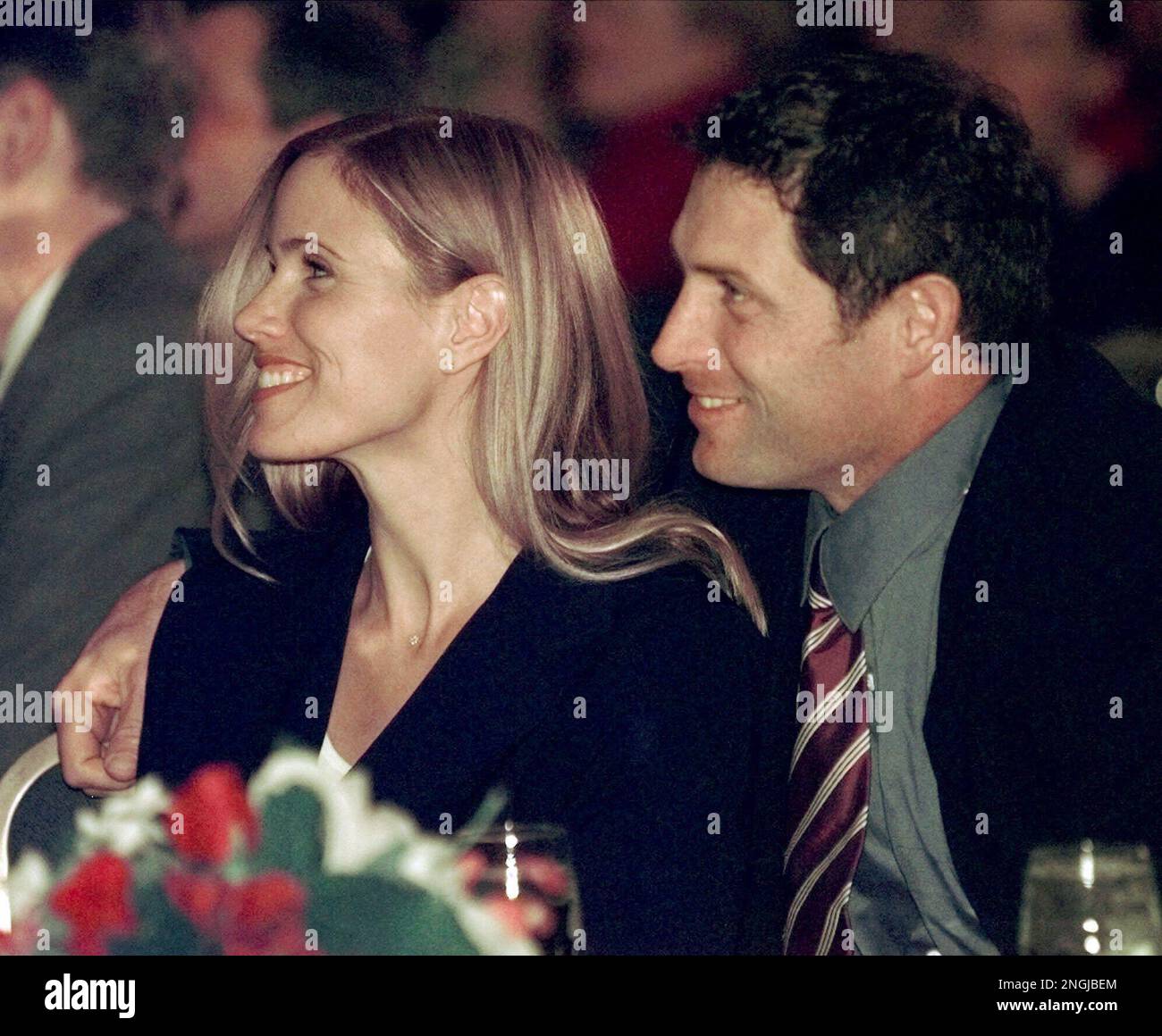 San Francisco 49ers quarterback Steve Young sits his fiancee, Barbara ...