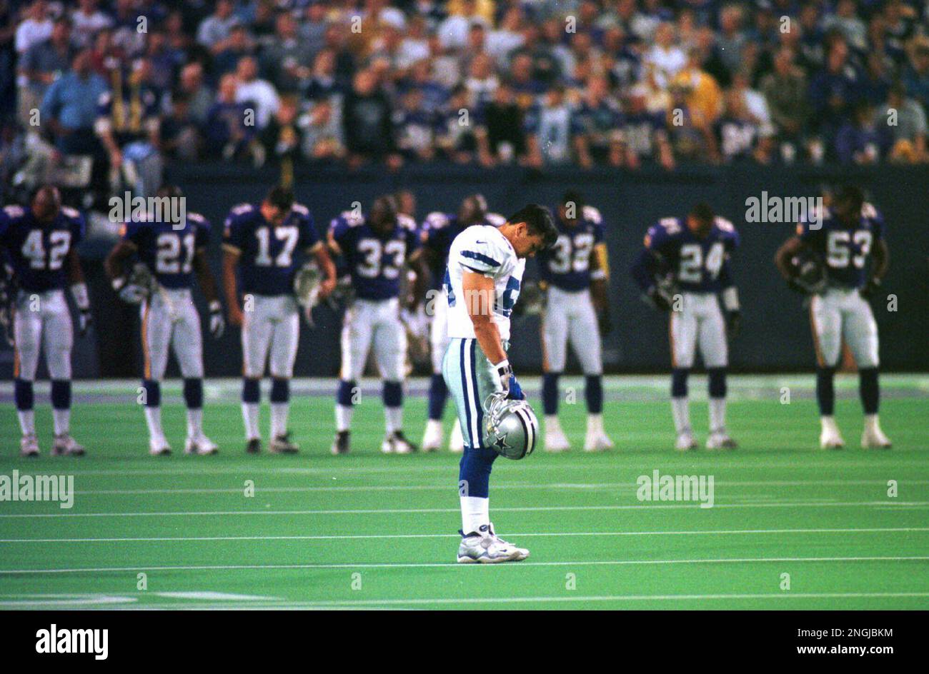 Dallas Cowboys center Mark Stepnoski bows his head as he, his team, the ...