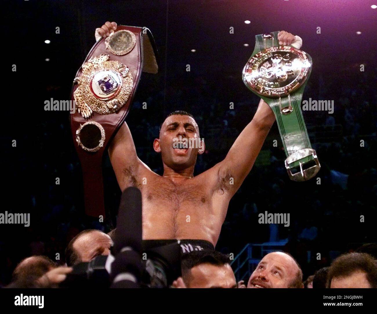 Prince Naseem Hamed of Britain holds up his two belts after defeating ...