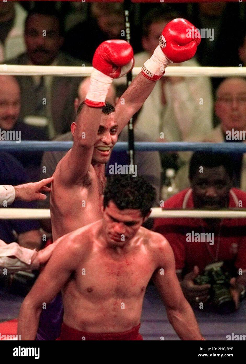 Prince Naseem Hamed of Britain raises his arms after the ninth round as ...