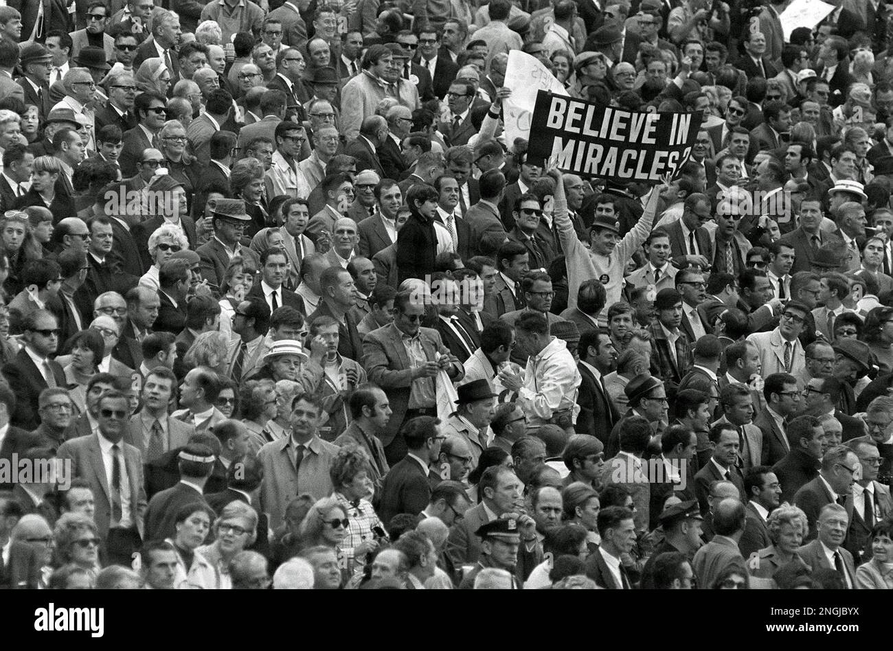 Karl Ehrhardt, the New York Mets fan known as the Sign Man, holds up an ...