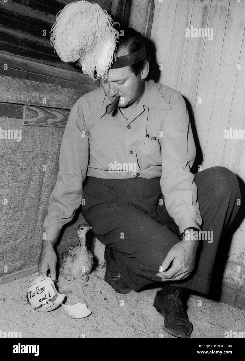 Hollywood publicist and stunt man Jim Moran is shown squatting over a ...