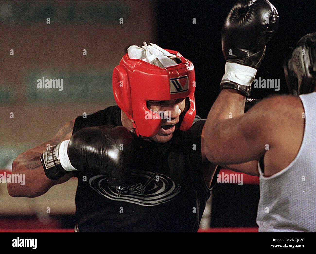 Mike Tyson spars with Everett Martin during a workout at the MGM Grand ...