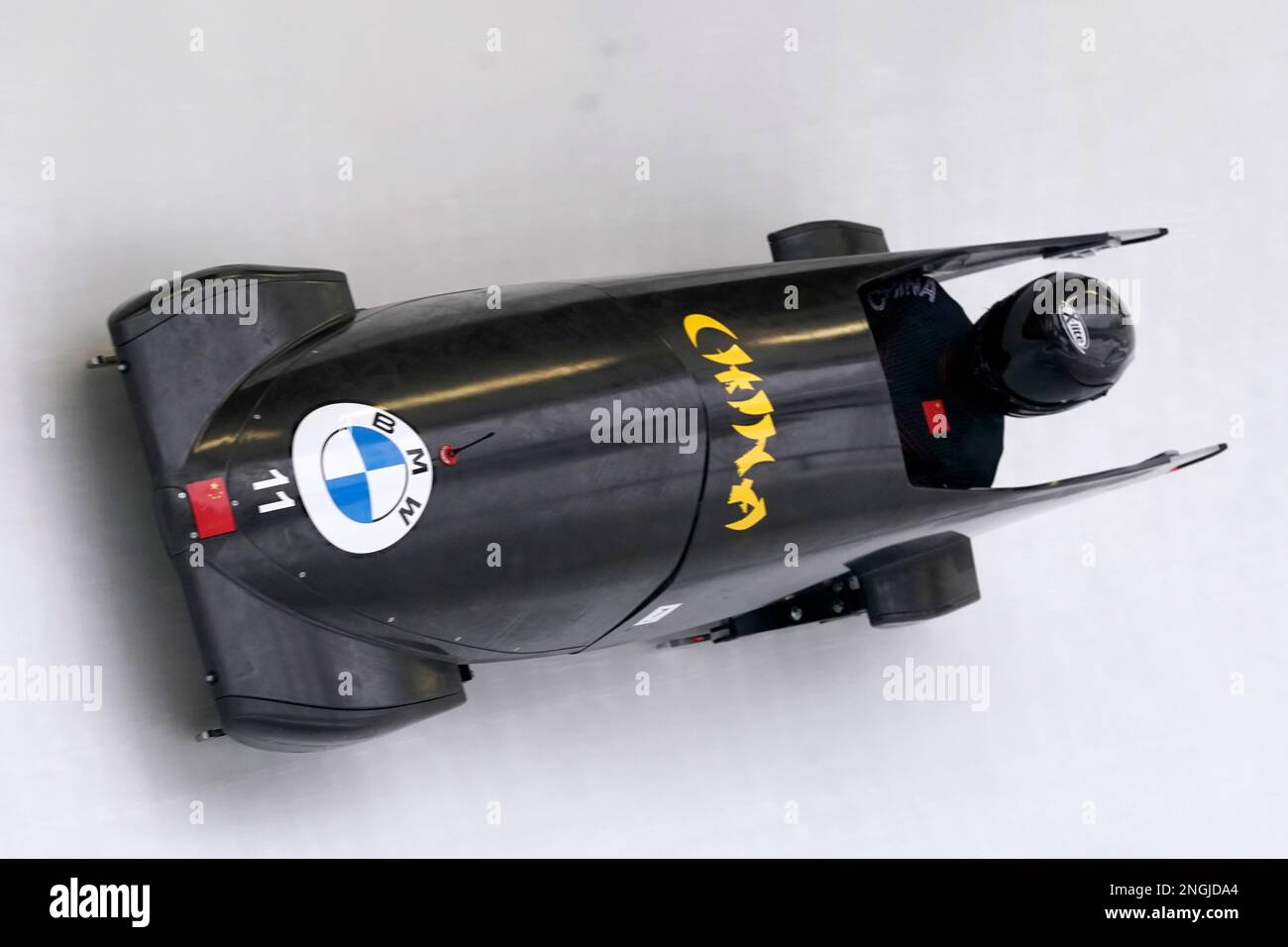 Qing Ying of China speeds down the track during her first run of the ...