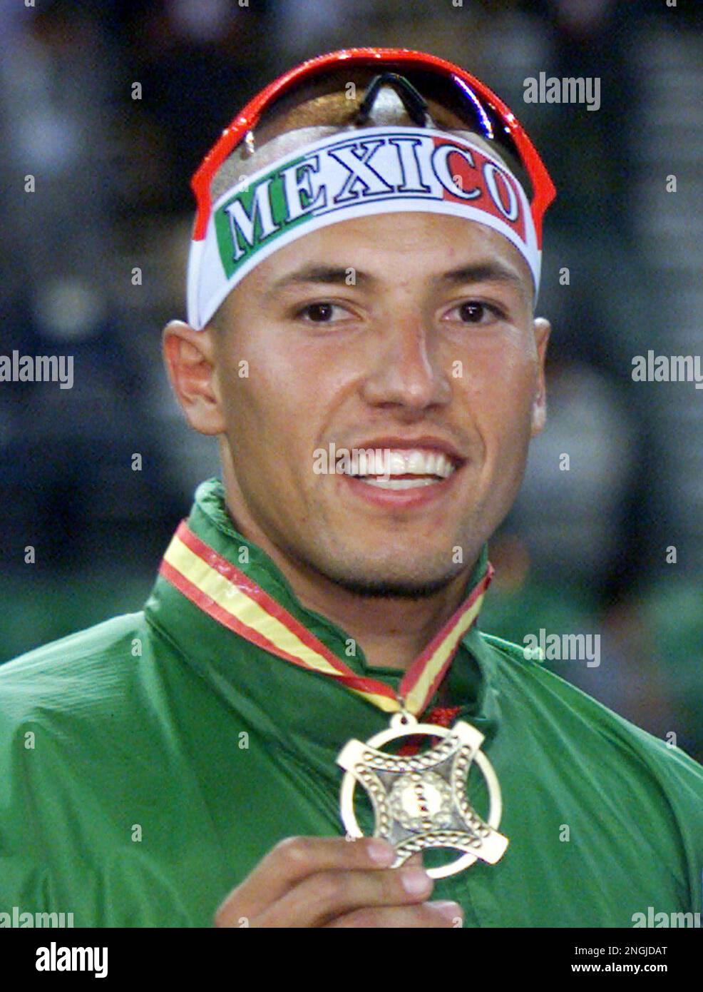 Mexico's Alejandro Cardenas, third placed in the men's 400-meter event, shows off his bronze ...