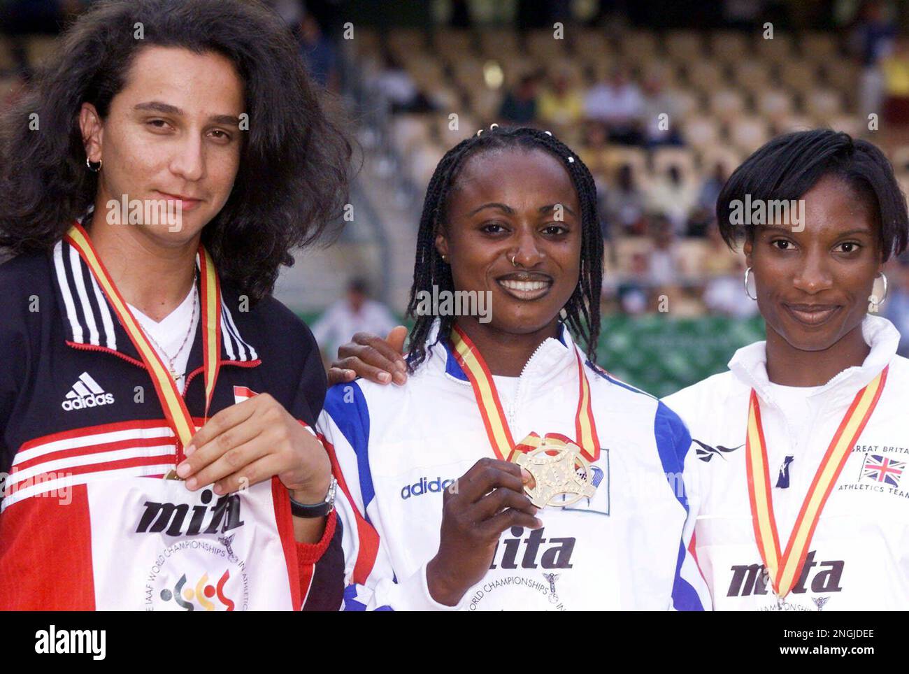 France's Eunice Barber, center, the gold medalist, is flanked by ...