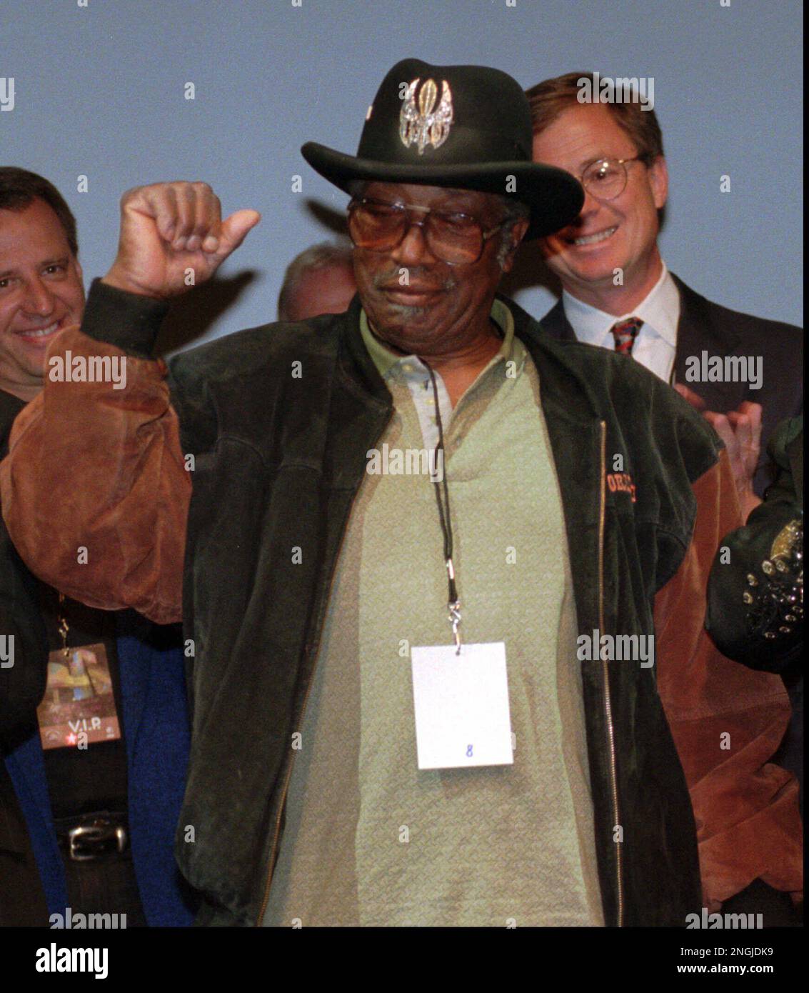 Bo Diddley waves to the crowd at the opening of the new Hall of Fame ...
