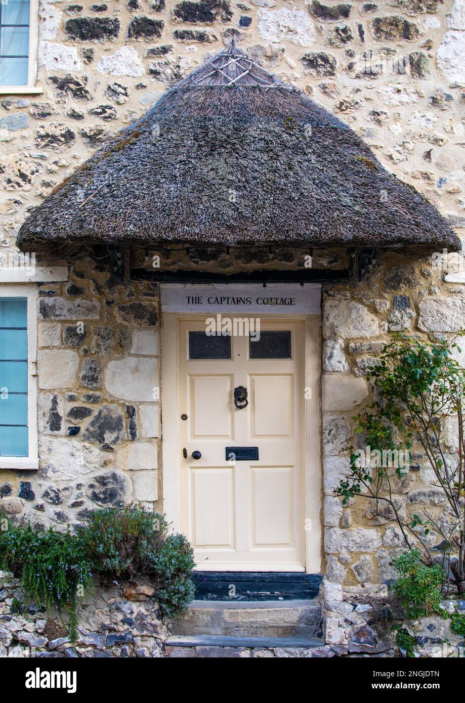 A picturesque doorway in the fishing village of Beer in Devon, England ...