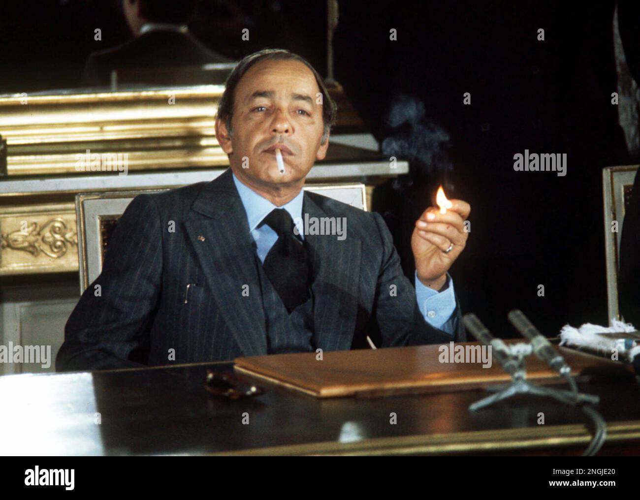King Hassan II lights his cigarette during a press conference Nov. 11 ...