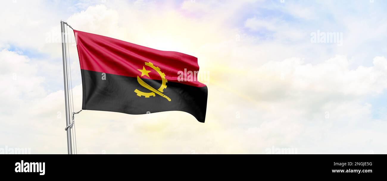 Angola flag waving on sky background. 3D Rendering Stock Photo - Alamy