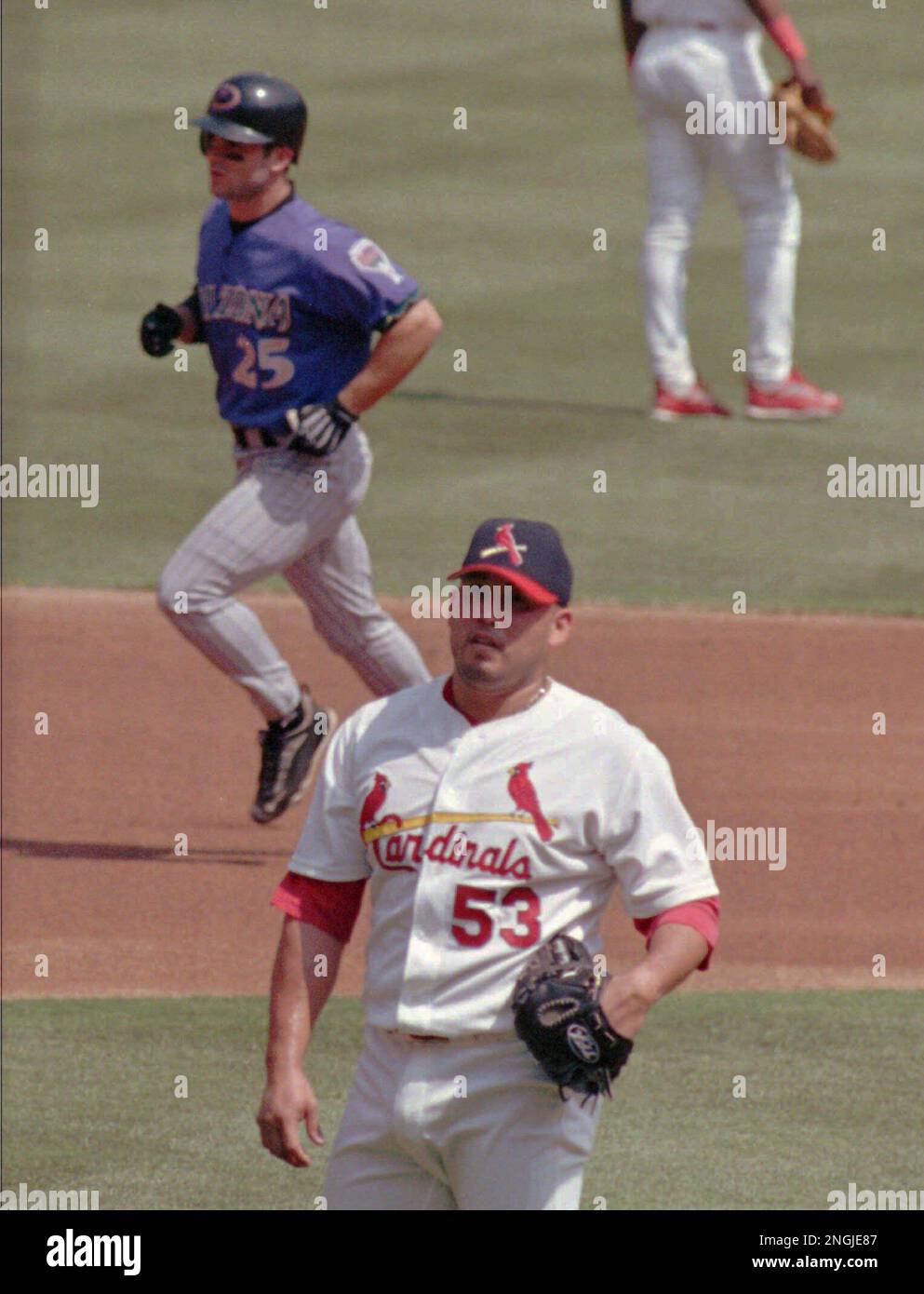Arizona Diamondbacks' David Dellucci rounds second base after hitting a ...