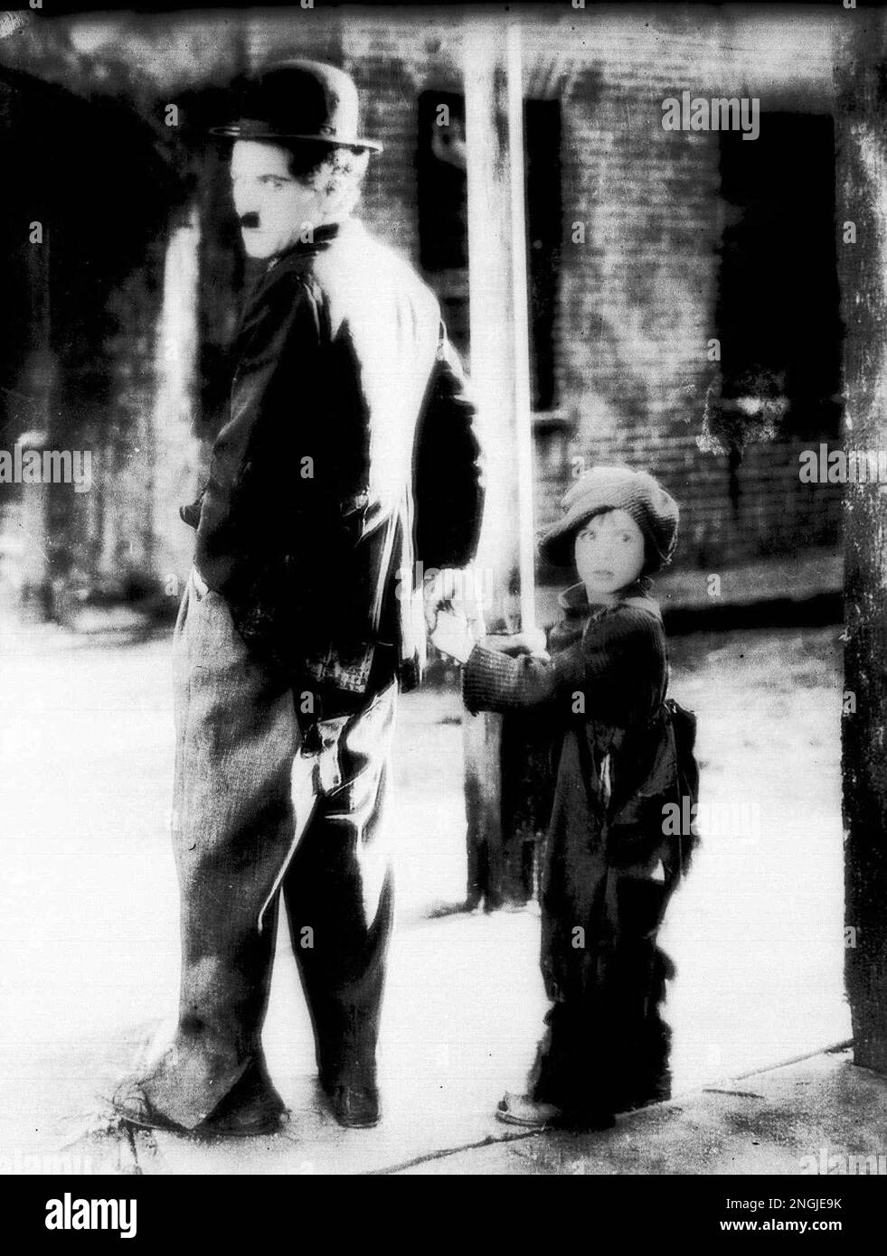 Charlie Chaplin, left, appears in character with Jackie Coogan in the ...