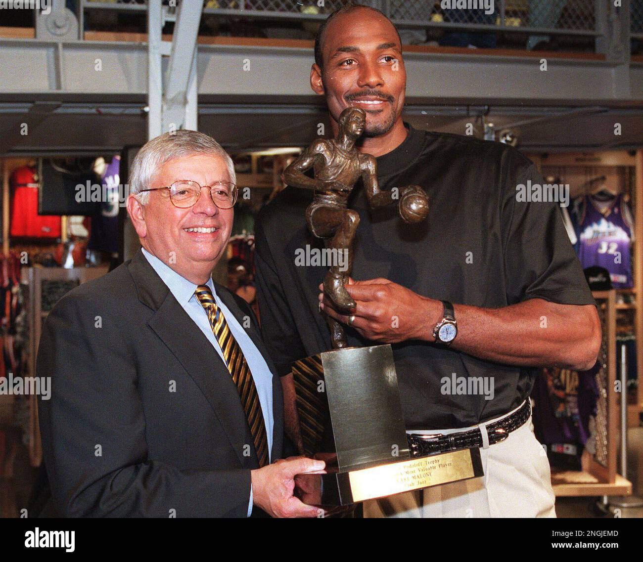 Utah Jazz forward Karl Malone, right, receives the NBA's MVP award for ...