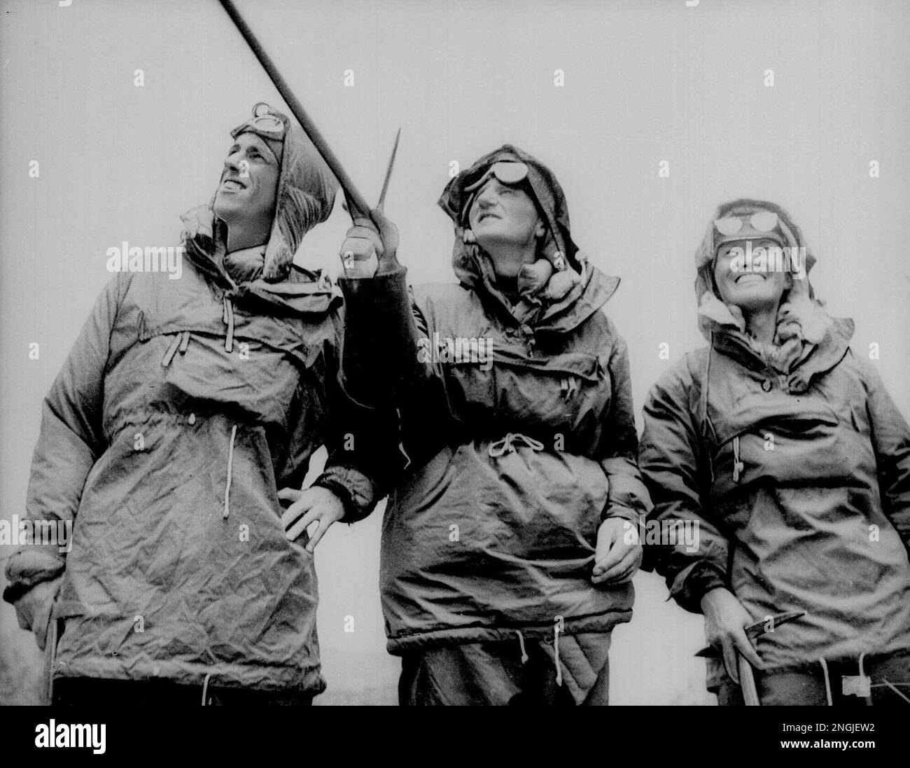 A July 1953 photo shows Edmund Hillary, Col. John Hunt, and Sherpa Tenzing Norgay, left to right ...