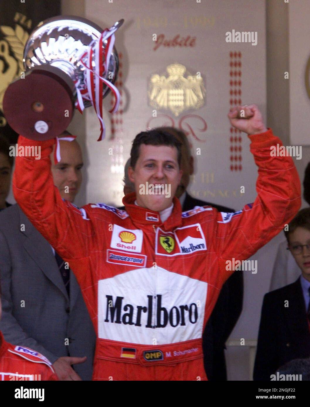 German Ferrari driver Michael Schumacher holds his cup after winning ...