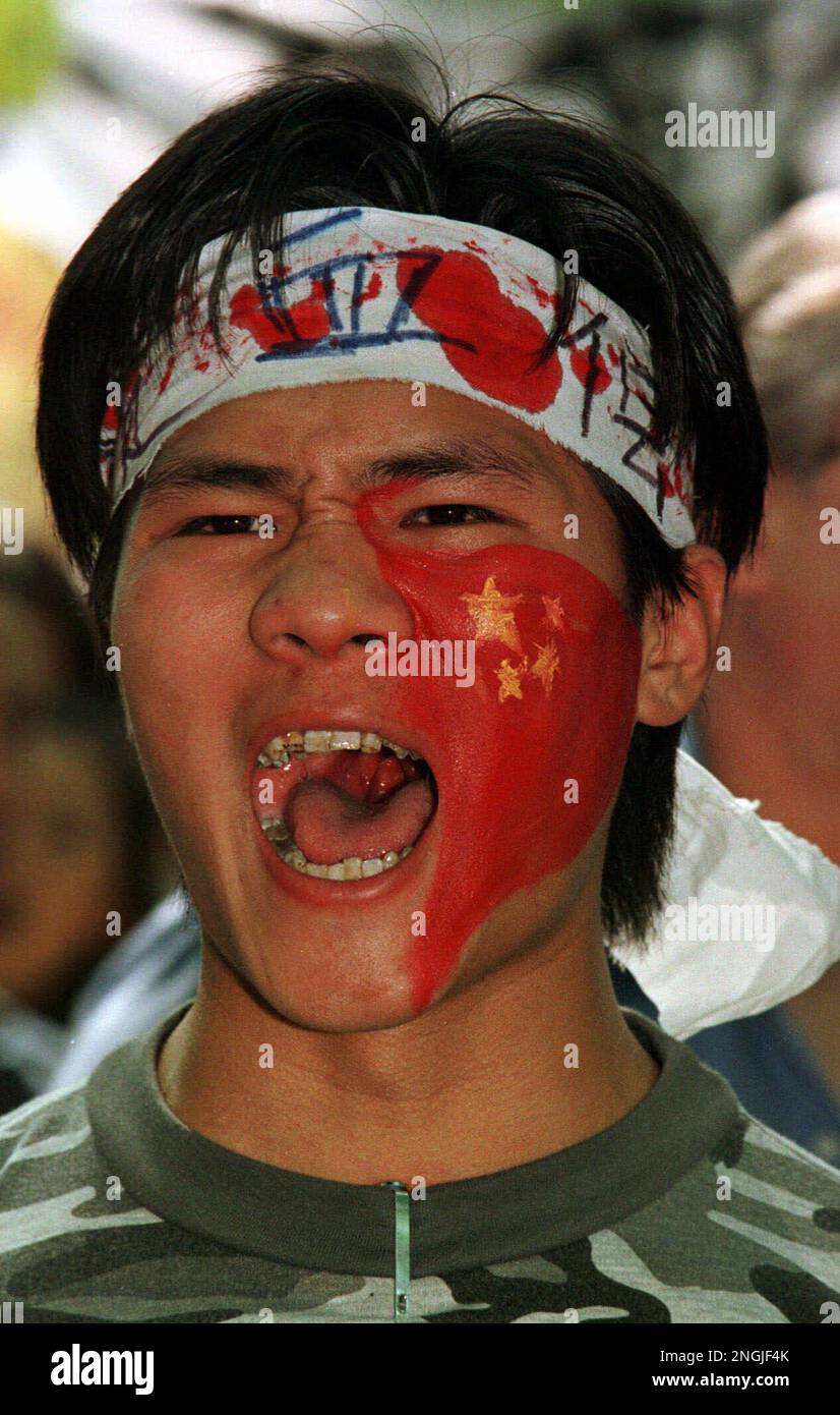 A protester yells anti-United States slogans as he prepares to march ...